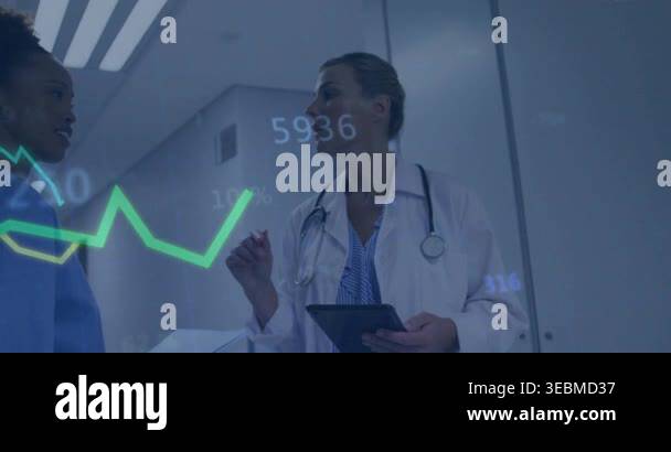 Doctor reviewing patient data pointing 3D graphs after nurse handing ...