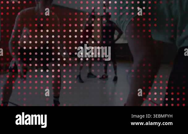 Men playing basketball in wood panel gym, showcasing animated red dot ...