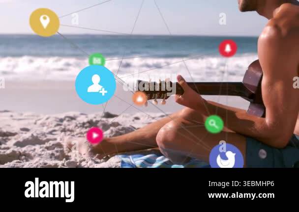 Playing guitar on beach, man surrounded by animation of social media ...