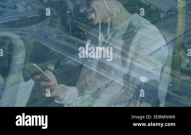 Animation of cars on street over caucasian man using smartphone. Global ...