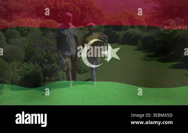 Couple walking hand in hand during health campaign carrying watering ...