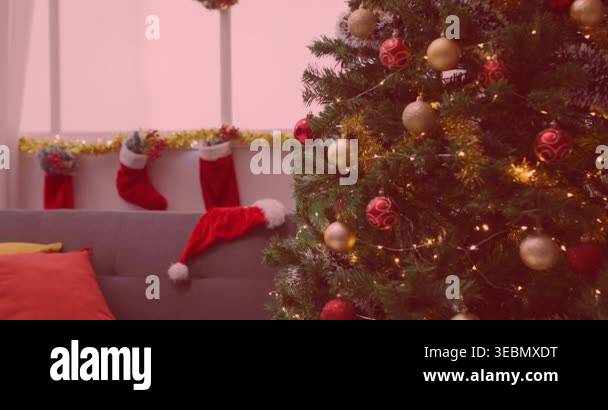 Animation of happy holidays text over christmas tree with decorations ...