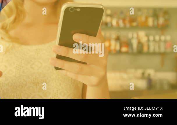 Animation of media icons over caucasian businessman using smartphone ...