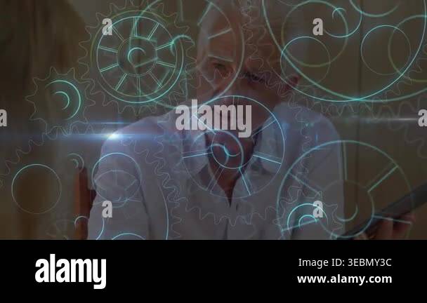 Animation of cogs over caucasian male doctor and patient. Global ...