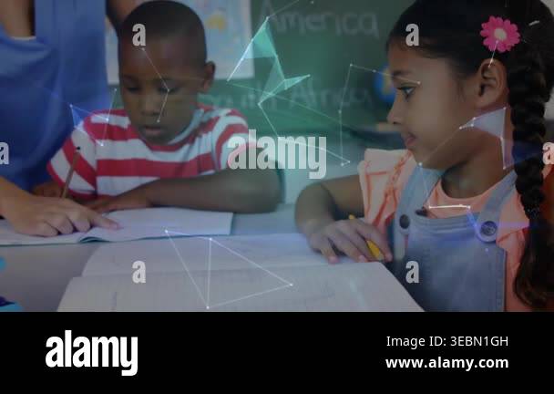 Teacher leaning over workbook pointing, helping boy gain literacy in ...