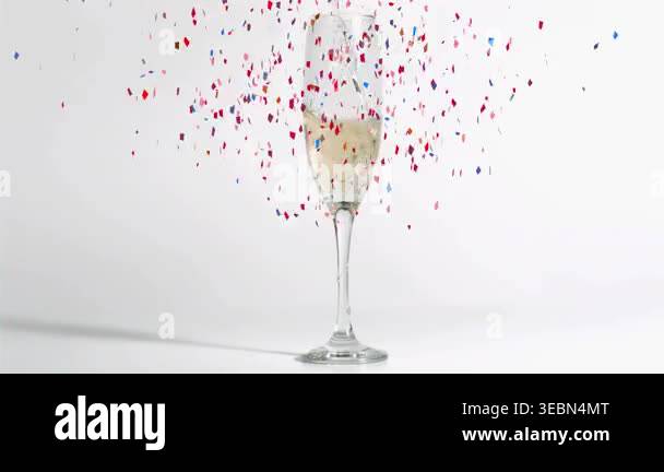 Animation of confetti falling over champagne glass on white background ...