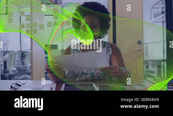 Woman lifting sheet, holding booklet for business review while green ...