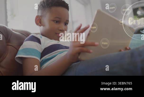Boy tapping tablet on couch, exploring crypto app while HUD dials and ...