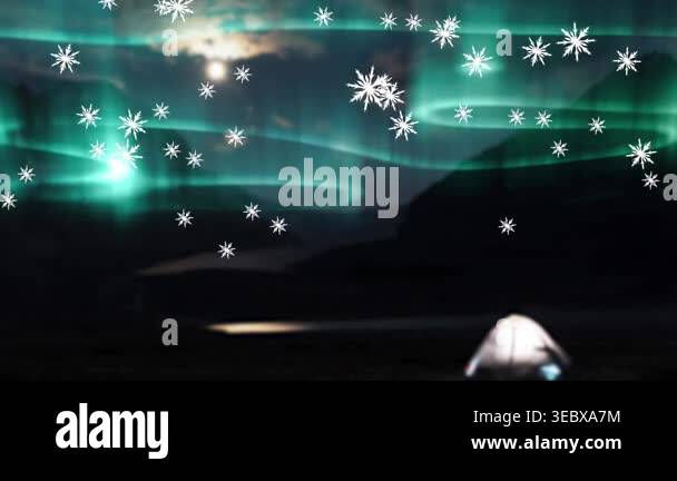 Animation of christmas snowflakes falling over aurora borealis in ...