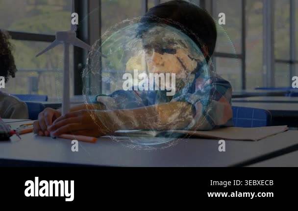 Right boy reaching, picking and passing to left boy as overlay globe ...