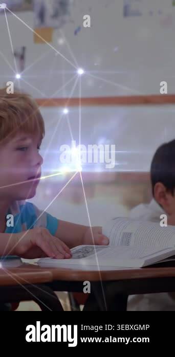 Vertical video: Class at desks, watching front as teacher starting ...