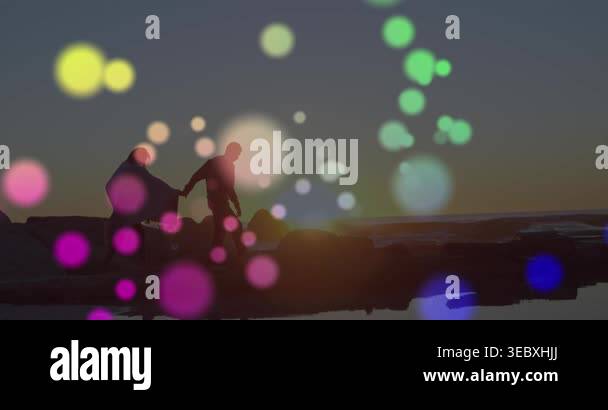Colorful spot of light over african american couple holding hands ...