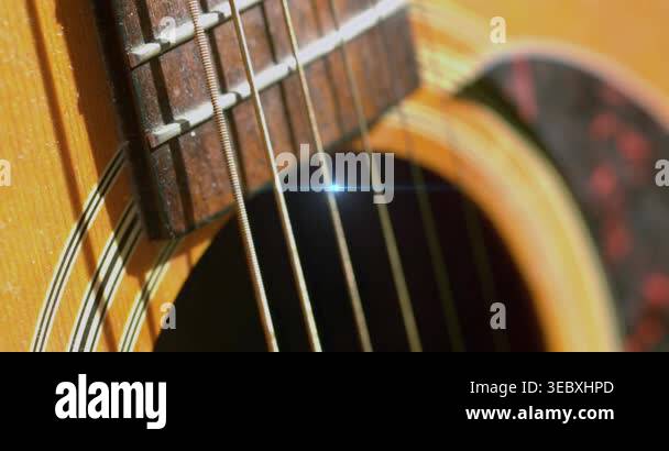 Animation of light flashing over guitar strings moving. Music ...