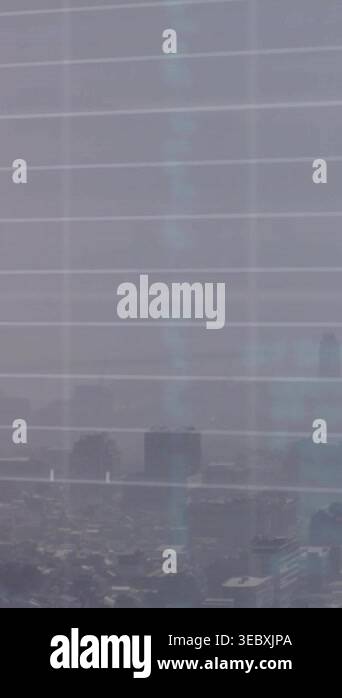 Vertical video: Glass activating overlay on hazy skyline, graphs rising ...