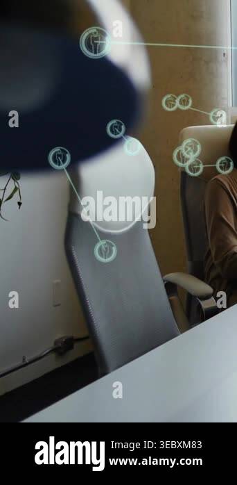 Vertical video: Hand moving revealing AR nodes pulsing on desk as woman ...