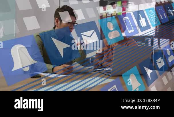 Man pointing to laptop, woman typing, reviewing paper in office as blue ...
