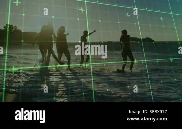 Playing in ocean waves, silhouetted people with digital grid animation ...