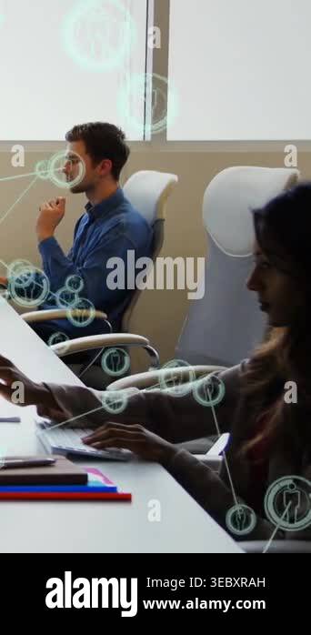 Vertical video: Woman typing on laptop and initiating holographic ...