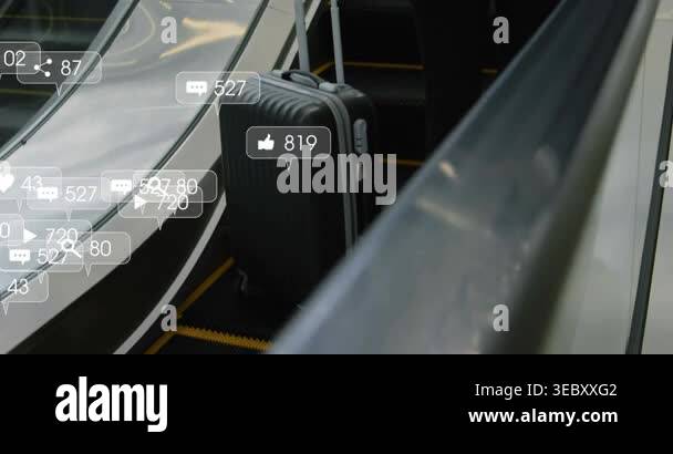 Businesswoman ascending escalator, pulling suitcase, tapping phone ...