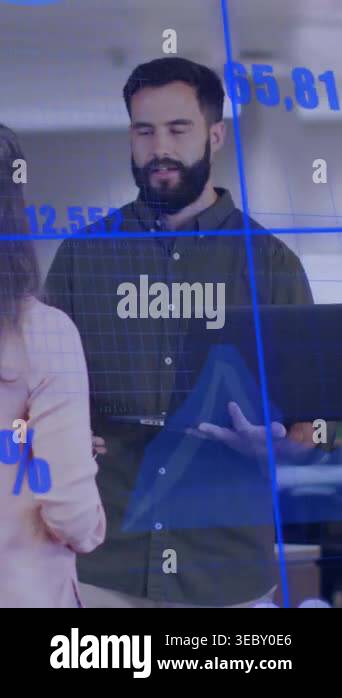 Vertical video: Man showing laptop starting blue data into sales chart ...