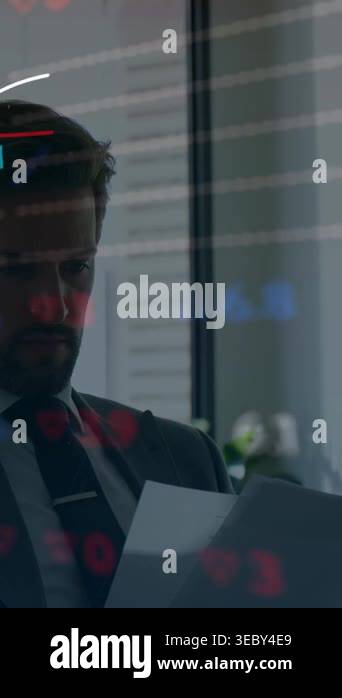Vertical video: Man picking reports, reading pages in office while ...