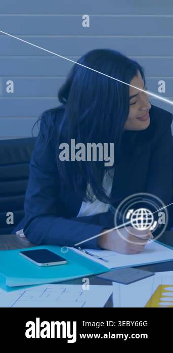 Writing woman in business attire responding to offscreen cue at meeting ...