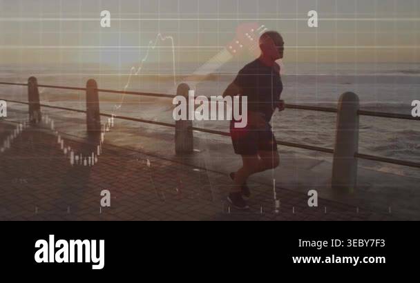 Senior runner accelerating past posts, exercising along seafront ...