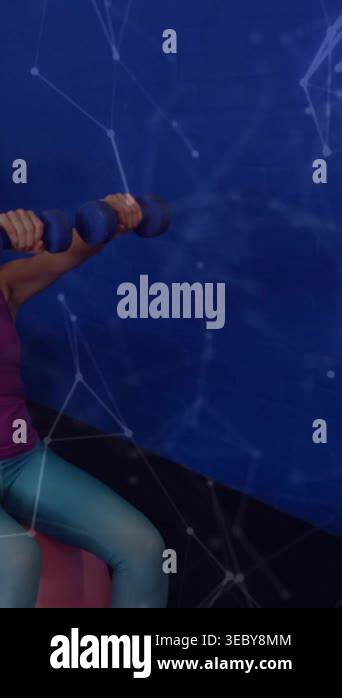 Vertical video: Woman on ball holding DBs, clip starting nodes over ...