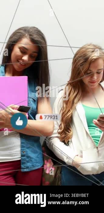 Students tapping phones and holding pink folder, spawning social media ...
