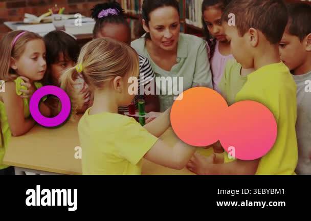 Vertical video: Diverse children, teacher cue, girl in yellow passing ...