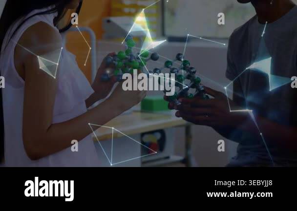 Two students bringing molecules together in science class, causing ...