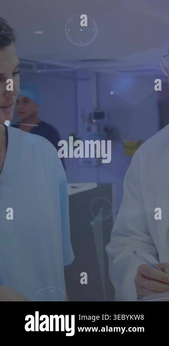 Vertical video: Nurse leaning to chart after MD pointing, reading notes ...