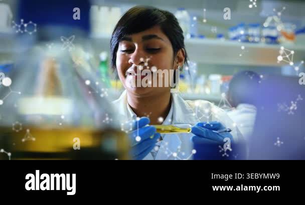 Scientist lifting gold vial, examining sample for research, molecular ...