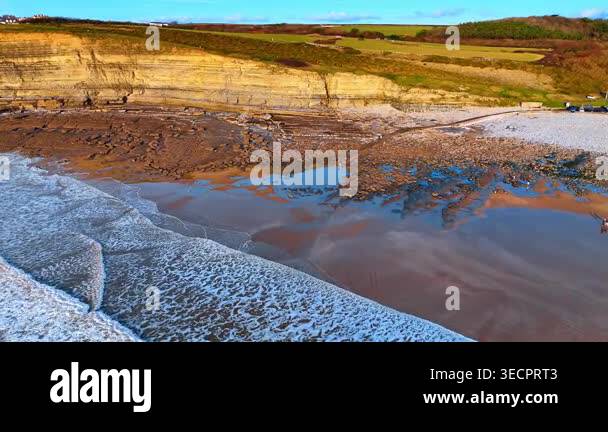 Aerial view of wave-cut platform and tide pools at Southerndown ...