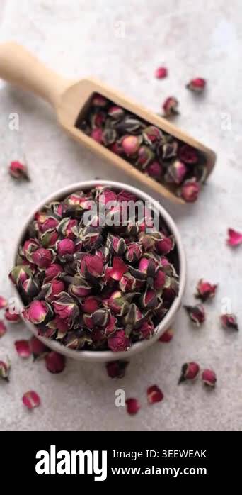 Dried rosebuds herbal tea rotating on a concrete background Stock Video ...