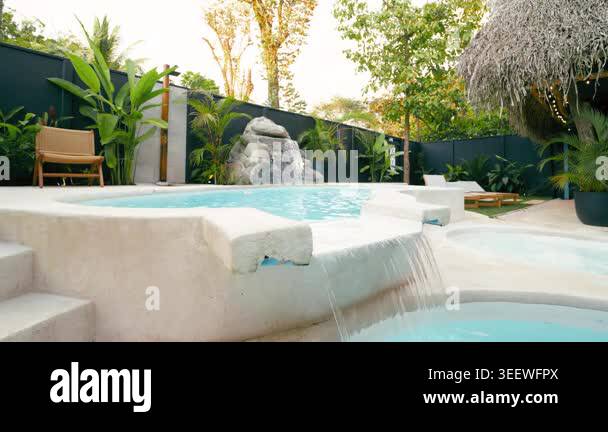 Beautiful outdoor swimming pool at a luxury tropical resort. Crystal ...