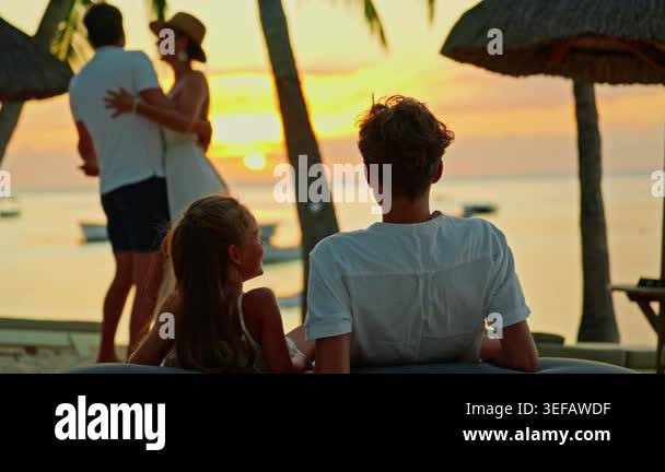 Silhouette couple are dancing at sunset and on beach ocean. Their ...