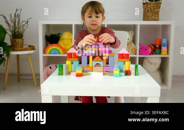 A child plays with wooden blocks. Selective focus. Kid Stock Video ...