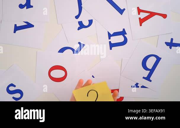 The child learns English letters. Selective focus. Kid Stock Video ...