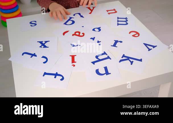 The child learns English letters. Selective focus. Kid Stock Video ...