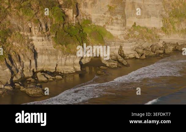 Aerial View of El Salvadors Majestic Coastline with Surfer Riding the ...