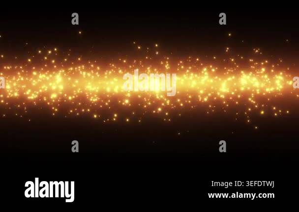 Brilliant golden hot sparks sparkle and flow horizontally across a dark ...