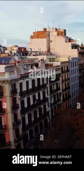 Explore the rooftops and structures of Barcelona from a high angle ...