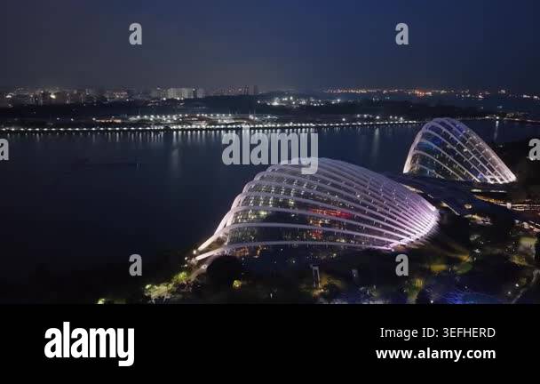 Singapore Marina Bay at night with downtown skyline reflected on water ...