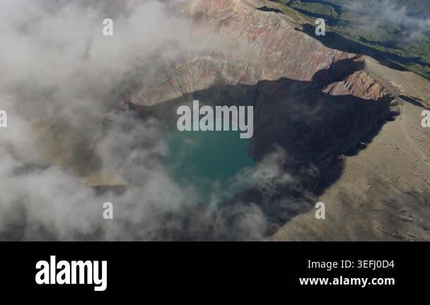 Aerial View of a Misty Volcanic Crater Lake in El Salvador Stock Video ...