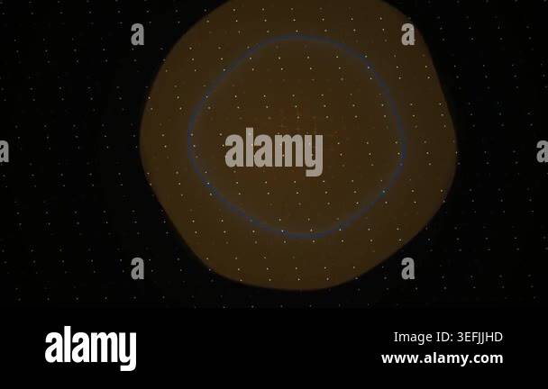 A soft glowing circular shape pulses and fades against a solid black ...