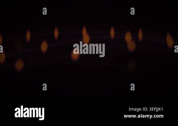 Soft, glowing bokeh lights in warm orange and yellow hues create a ...