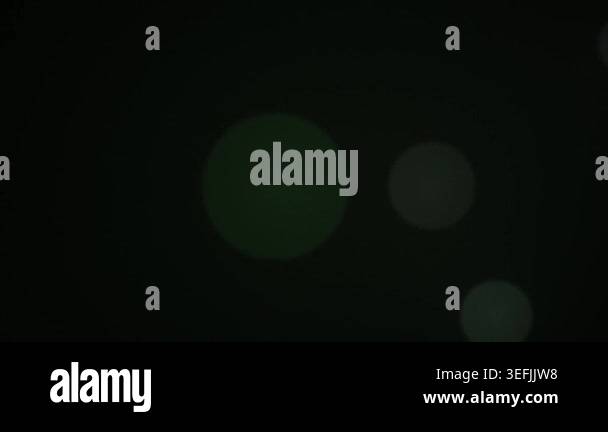 Soft, out-of-focus circular light effects (bokeh) in green and blue ...