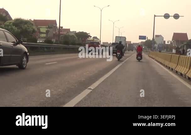 Street scenes in Hai Phong city. Traffic flows continuously at ...