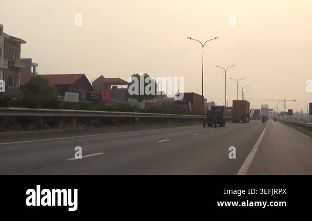 Street scenes in Hai Phong city. Traffic flows continuously at ...